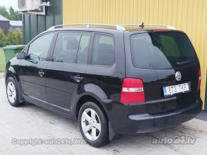 Black Volkswagen Touran 2006 in Tartu, with an engine capacity of 2.00 L and mileage of 300 thousand km for 1990 €, photo 7 on AUTOMOTO.COM.LV