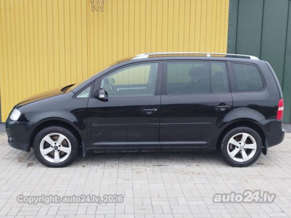 Melns Volkswagen Touran 2006 Tartu, ar dzinēja tilpumu 2.00 L un nobraukumu 300 tūkst. km par 1990 €, foto 7 vietnē AUTOMOTO.COM.LV
