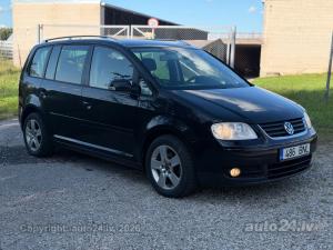 Black Volkswagen Touran 2006 in Tartu, with an engine capacity of 2.00 L and mileage of 277 thousand km for 2300 €, photo 1 on AUTOMOTO.COM.LV