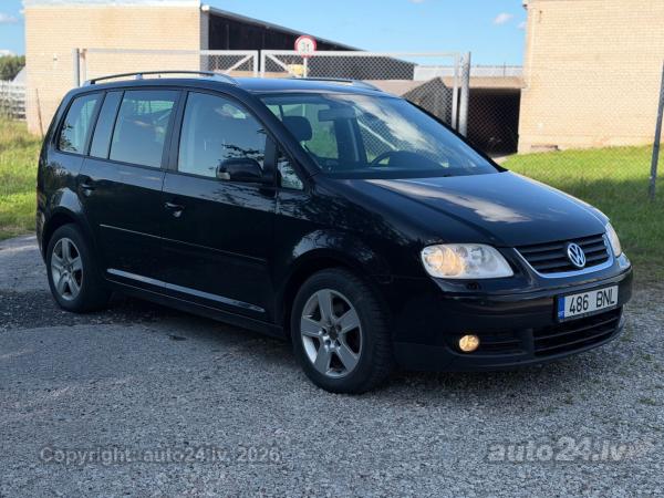 Black Volkswagen Touran 2006 in Tartu, with an engine capacity of 2.00 L and mileage of 277 thousand km for 2300 €, photo 1 on AUTOMOTO.COM.LV