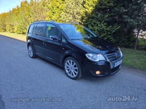 Melns Volkswagen Touran 2008 Tallina, ar dzinēja tilpumu 1.40 L un nobraukumu 275 tūkst. km par 4444 €, foto  vietnē AUTOMOTO.COM.LV