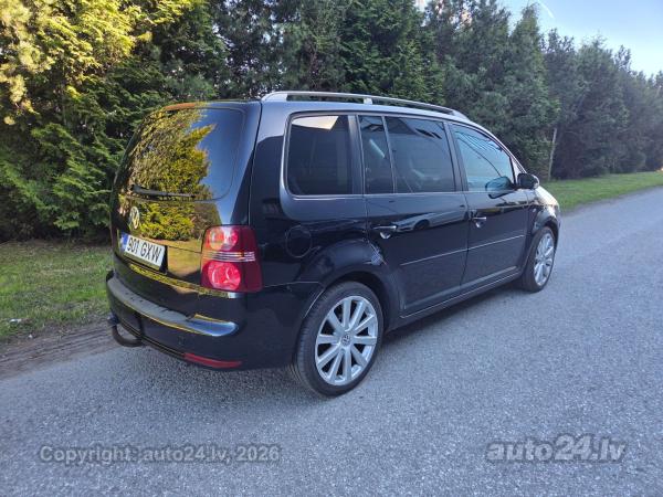 Black Volkswagen Touran 2008 in Tallinn, with an engine capacity of 1.40 L and mileage of 275 thousand km for 4444 €, photo 2 on AUTOMOTO.COM.LV