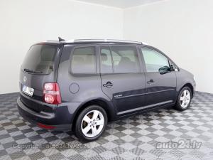 Black Volkswagen Touran 2008 in Tallinn, with an engine capacity of 1.40 L and mileage of 211 thousand km for 2699 €, photo 4 on AUTOMOTO.COM.LV