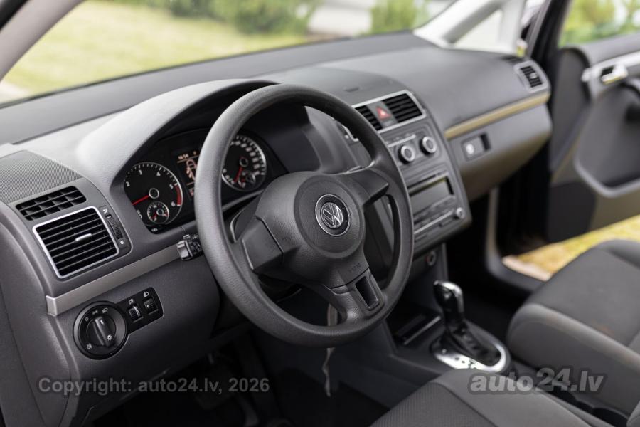 Black Volkswagen Touran 2011 in Tallinn, with an engine capacity of 1.60 L and mileage of 351 thousand km for 4999 €, photo 8 on AUTOMOTO.COM.LV