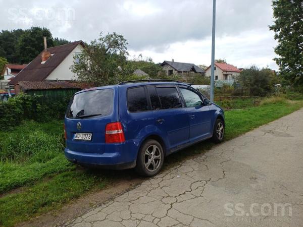 Zils Volkswagen Touran 2005 Ogre, ar dzinēja tilpumu 1.90 L un nobraukumu 390 tūkst. km par 1800 €, foto 9 vietnē AUTOMOTO.COM.LV