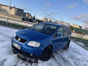 Blue Volkswagen Touran 2005 in Kaunas, with an engine capacity of 1.97 L and mileage of 392 thousand km for 1550 €, photo  on AUTOMOTO.COM.LV