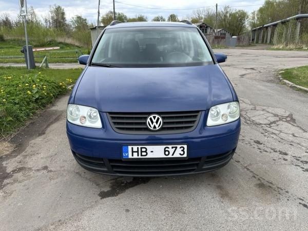 Zils Volkswagen Touran 2005 Rīga, ar dzinēja tilpumu 1.90 L un nobraukumu 166 tūkst. km par 2900 €, foto 2 vietnē AUTOMOTO.COM.LV