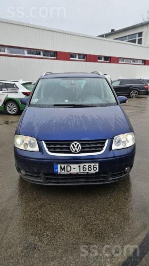 Blue Volkswagen Touran 2006 in Riga, with an engine capacity of 2.00 L and mileage of 390 thousand km for 600 €, photo  on AUTOMOTO.COM.LV