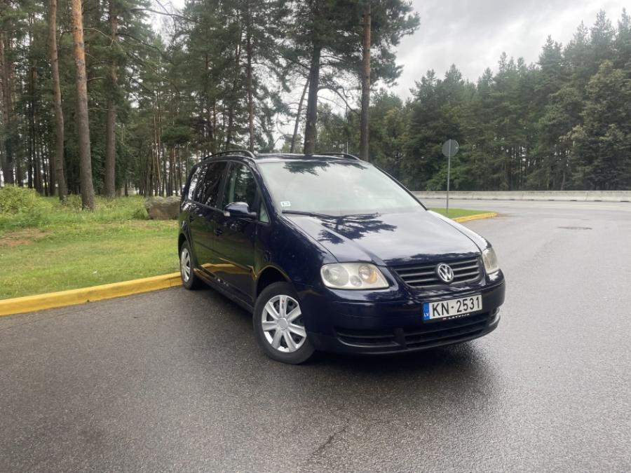 Zils Volkswagen Touran 2006 Rīga, ar dzinēja tilpumu 1.90 L un nobraukumu 381 tūkst. km par 2590 €, foto 12 vietnē AUTOMOTO.COM.LV