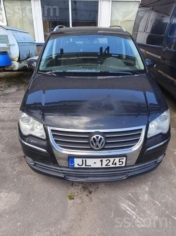 Zils Volkswagen Touran 2006 Rīga, ar dzinēja tilpumu 2.00 L un nobraukumu 390 tūkst. km par 1000 €, foto 1 vietnē AUTOMOTO.COM.LV