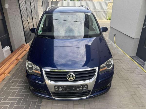 Zils Volkswagen Touran 2007 Marijampole, ar dzinēja tilpumu 1.39 L un nobraukumu 250 tūkst. km par 2800 €, foto 2 vietnē AUTOMOTO.COM.LV