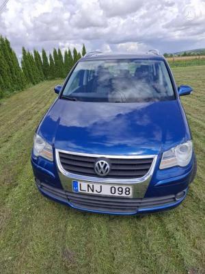 Blue Volkswagen Touran 2007 in Kaunas, with an engine capacity of 1.97 L and mileage of 292 thousand km for 2900 €, photo 3 on AUTOMOTO.COM.LV