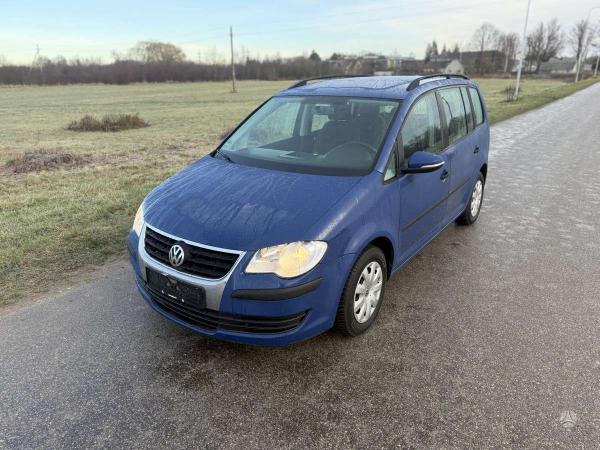 Blue Volkswagen Touran 2009 in Vilkaviskis, with an engine capacity of 1.99 L and mileage of 244 thousand km for 3299 €, photo 1 on AUTOMOTO.COM.LV