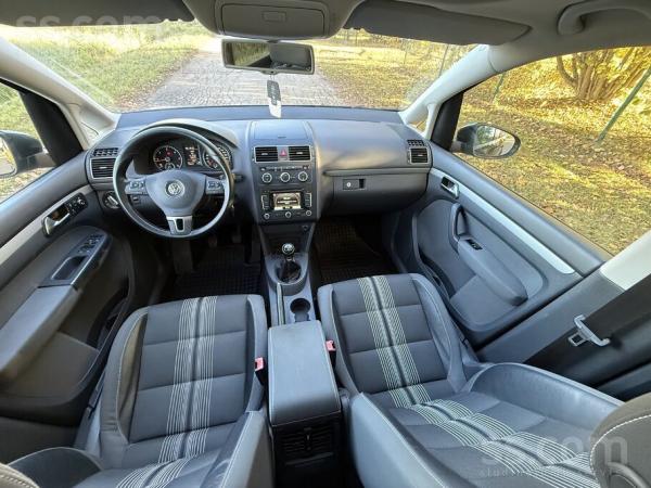 Blue Volkswagen Touran 2012 in Jelgava, with an engine capacity of 2.00 L and mileage of 198 thousand km for 6890 €, photo 11 on AUTOMOTO.COM.LV