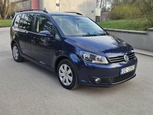 Blue Volkswagen Touran 2012 in Jekabpils, with an engine capacity of 2.00 L and mileage of 313 thousand km for 6890 €, photo 4 on AUTOMOTO.COM.LV