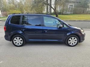 Blue Volkswagen Touran 2012 in Jekabpils, with an engine capacity of 2.00 L and mileage of 313 thousand km for 6890 €, photo 5 on AUTOMOTO.COM.LV