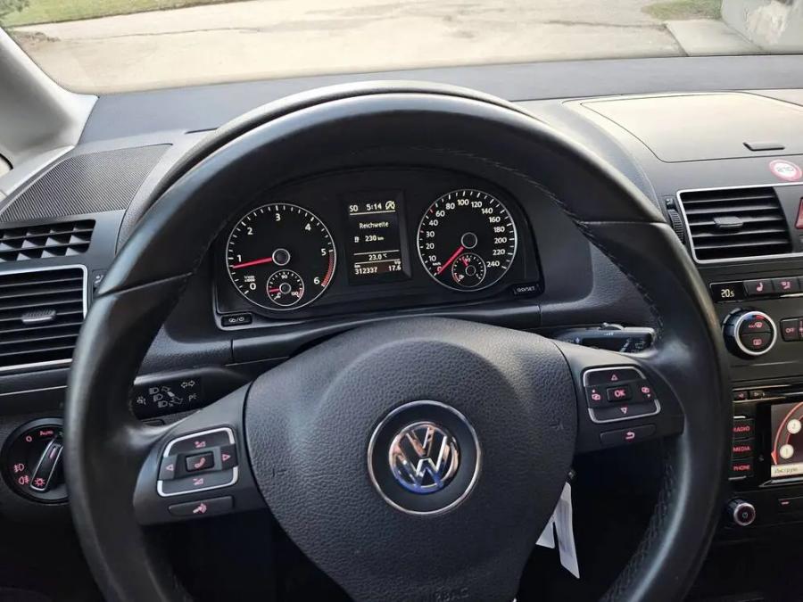 Blue Volkswagen Touran 2012 in Jekabpils, with an engine capacity of 2.00 L and mileage of 313 thousand km for 6890 €, photo 32 on AUTOMOTO.COM.LV