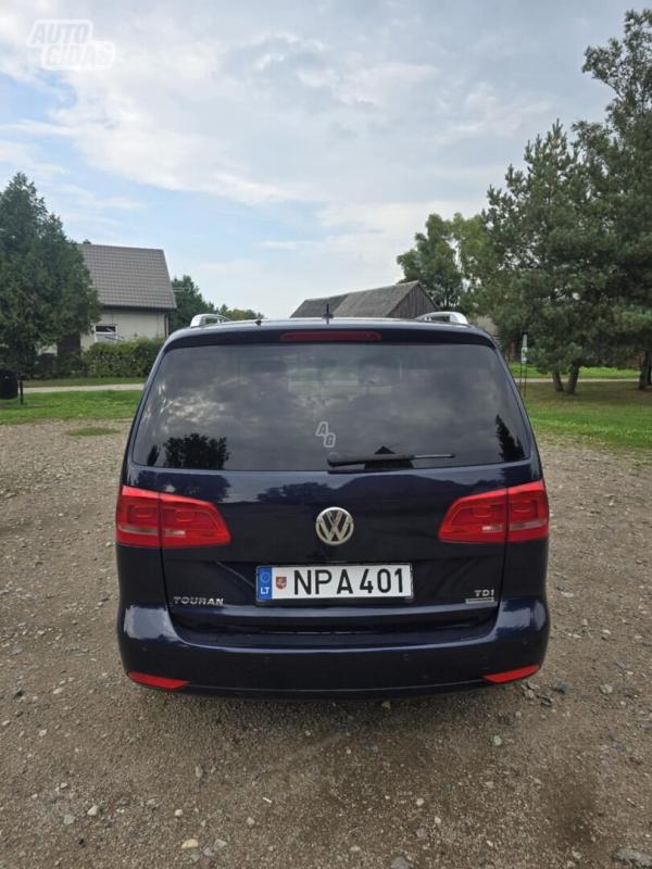 Blue Volkswagen Touran 2013 in Panevezys, with an engine capacity of 1.60 L and mileage of 284 thousand km for 5800 €, photo 4 on AUTOMOTO.COM.LV