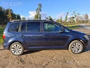 Blue Volkswagen Touran 2013 in Liepaja, with an engine capacity of 2.00 L and mileage of 274 thousand km for 7200 €, photo 4 on AUTOMOTO.COM.LV