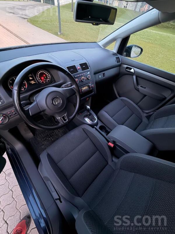 Blue Volkswagen Touran 2014 in Riga, with an engine capacity of 1.60 L and mileage of 202 thousand km for 7500 €, photo 7 on AUTOMOTO.COM.LV