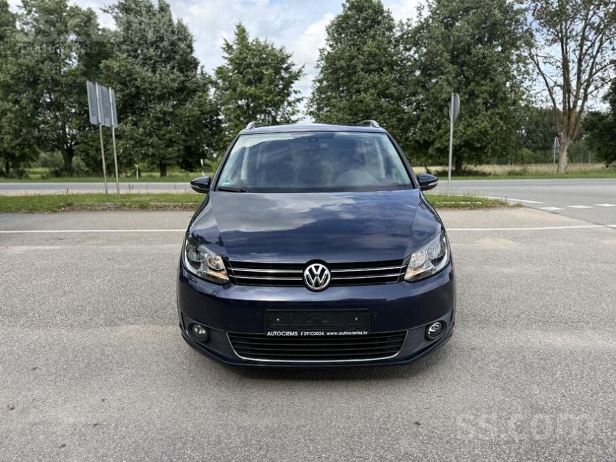 Blue Volkswagen Touran 2014 in Ogre, with an engine capacity of 1.60 L and mileage of 188 thousand km for 8199 €, photo 4 on AUTOMOTO.COM.LV