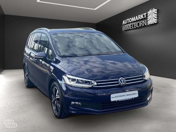 Blue Volkswagen Touran 2024 in Kaunas, with an engine capacity of 1.50 L and mileage of 23 thousand km for 33167 €, photo 2 on AUTOMOTO.COM.LV