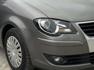 Brown Volkswagen Touran 2009 in Kretinga, with an engine capacity of 1.39 L and mileage of 199 thousand km for 3999 €, photo 7 on AUTOMOTO.COM.LV