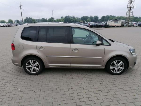Brown Volkswagen Touran 2011 in Marijampole, with an engine capacity of 1.40 L and mileage of 215 thousand km for 3950 €, photo 4 on AUTOMOTO.COM.LV