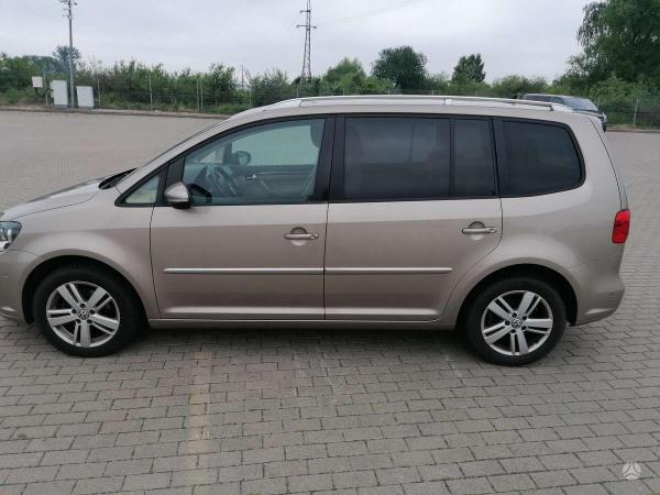 Brown Volkswagen Touran 2011 in Marijampole, with an engine capacity of 1.40 L and mileage of 215 thousand km for 3950 €, photo 8 on AUTOMOTO.COM.LV
