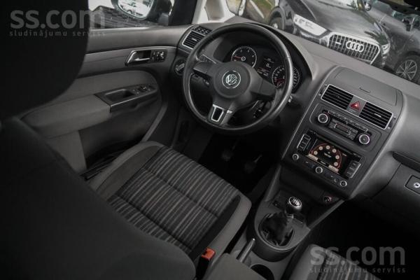 Brown Volkswagen Touran 2011 in Riga, with an engine capacity of 1.60 L and mileage of 272 thousand km for 6990 €, photo 7 on AUTOMOTO.COM.LV