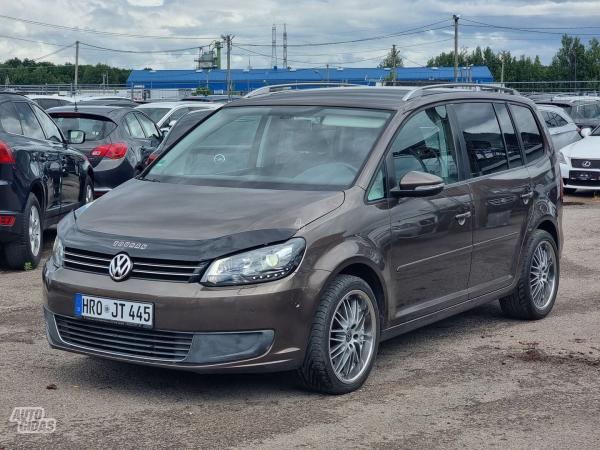 Brown Volkswagen Touran 2011 in Kaunas, with an engine capacity of 1.40 L and mileage of 252 thousand km for 4500 €, photo 1 on AUTOMOTO.COM.LV