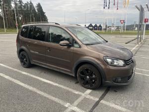 Brown Volkswagen Touran 2011 in Riga, with an engine capacity of 2.00 L and mileage of 410 thousand km for 6500 €, photo  on AUTOMOTO.COM.LV