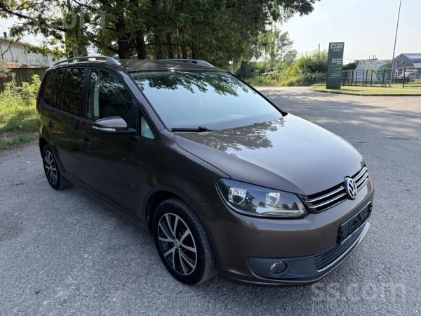Brūns Volkswagen Touran 2012 Ogre, ar dzinēja tilpumu 2.00 L un nobraukumu 239 tūkst. km par 7999 €, foto 1 vietnē AUTOMOTO.COM.LV