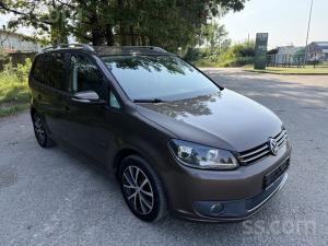 Brūns Volkswagen Touran 2012 Ogre, ar dzinēja tilpumu 2.00 L un nobraukumu 239 tūkst. km par 7999 €, foto  vietnē AUTOMOTO.COM.LV