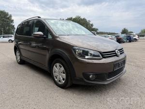 Brown Volkswagen Touran 2012 in Riga, with an engine capacity of 2.00 L and mileage of 280 thousand km for 7180 €, photo 3 on AUTOMOTO.COM.LV