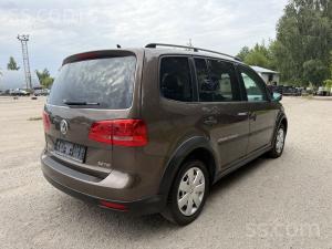 Brown Volkswagen Touran 2012 in Riga, with an engine capacity of 2.00 L and mileage of 280 thousand km for 7180 €, photo 4 on AUTOMOTO.COM.LV