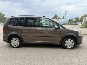 Brown Volkswagen Touran 2012 in Riga, with an engine capacity of 2.00 L and mileage of 280 thousand km for 7180 €, photo 8 on AUTOMOTO.COM.LV