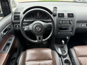 Brown Volkswagen Touran 2012 in Riga, with an engine capacity of 2.00 L and mileage of 280 thousand km for 7180 €, photo 11 on AUTOMOTO.COM.LV