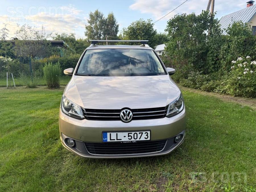 Brown Volkswagen Touran 2012 in Riga, with an engine capacity of 2.00 L and mileage of 300 thousand km for 5800 €, photo 3 on AUTOMOTO.COM.LV