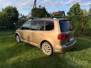 Brown Volkswagen Touran 2012 in Riga, with an engine capacity of 2.00 L and mileage of 300 thousand km for 5800 €, photo 4 on AUTOMOTO.COM.LV