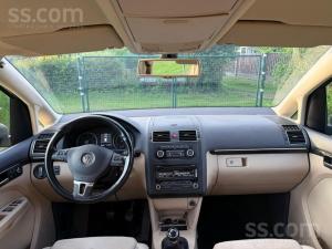 Brown Volkswagen Touran 2012 in Riga, with an engine capacity of 2.00 L and mileage of 300 thousand km for 5800 €, photo 7 on AUTOMOTO.COM.LV