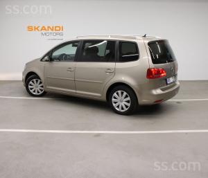 Brown Volkswagen Touran 2013 in Riga, with an engine capacity of 1.60 L and mileage of 274 thousand km for 8190 €, photo 6 on AUTOMOTO.COM.LV