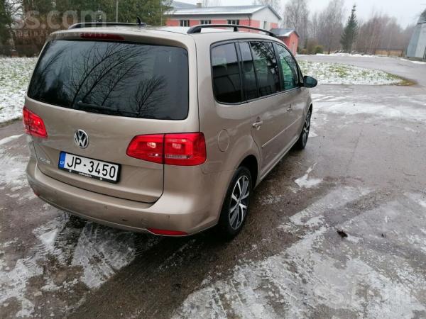 Brown Volkswagen Touran 2014 in Ogre, with an engine capacity of 1.60 L and mileage of 244 thousand km for 7999 €, photo 9 on AUTOMOTO.COM.LV