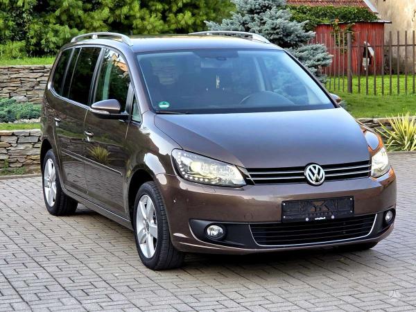 Brown Volkswagen Touran 2014 in Kedainiai, with an engine capacity of 1.97 L and mileage of 248 thousand km for 7850 €, photo 1 on AUTOMOTO.COM.LV
