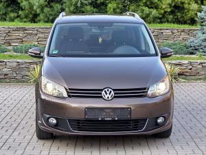 Brown Volkswagen Touran 2014 in Kedainiai, with an engine capacity of 1.97 L and mileage of 248 thousand km for 7850 €, photo 3 on AUTOMOTO.COM.LV