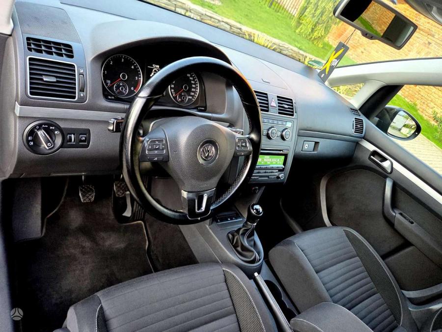 Brown Volkswagen Touran 2014 in Kedainiai, with an engine capacity of 1.97 L and mileage of 248 thousand km for 7850 €, photo 24 on AUTOMOTO.COM.LV
