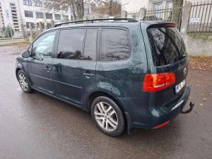 Green Volkswagen Touran 2011 in Kaunas, with an engine capacity of 1.39 L and mileage of 210 thousand km for 4350 €, photo 4 on AUTOMOTO.COM.LV