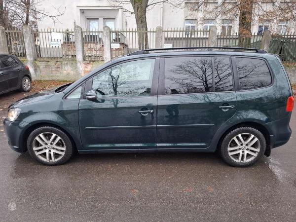 Green Volkswagen Touran 2011 in Kaunas, with an engine capacity of 1.39 L and mileage of 210 thousand km for 4350 €, photo 6 on AUTOMOTO.COM.LV
