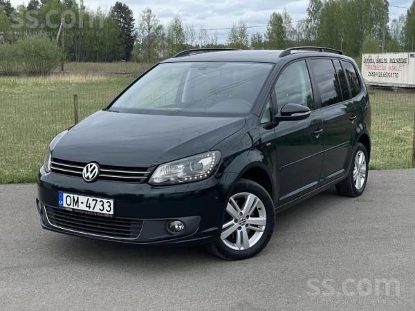 Green Volkswagen Touran 2012 in Ogre, with an engine capacity of 2.00 L and mileage of 289 thousand km for 7150 €, photo 1 on AUTOMOTO.COM.LV