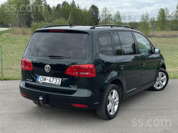 Green Volkswagen Touran 2012 in Ogre, with an engine capacity of 2.00 L and mileage of 289 thousand km for 7150 €, photo 6 on AUTOMOTO.COM.LV